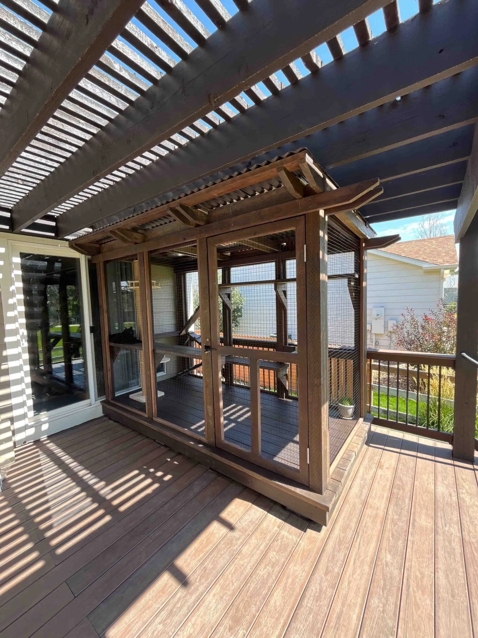 Enclosed Catio on Raised Deck | The Deck Den
