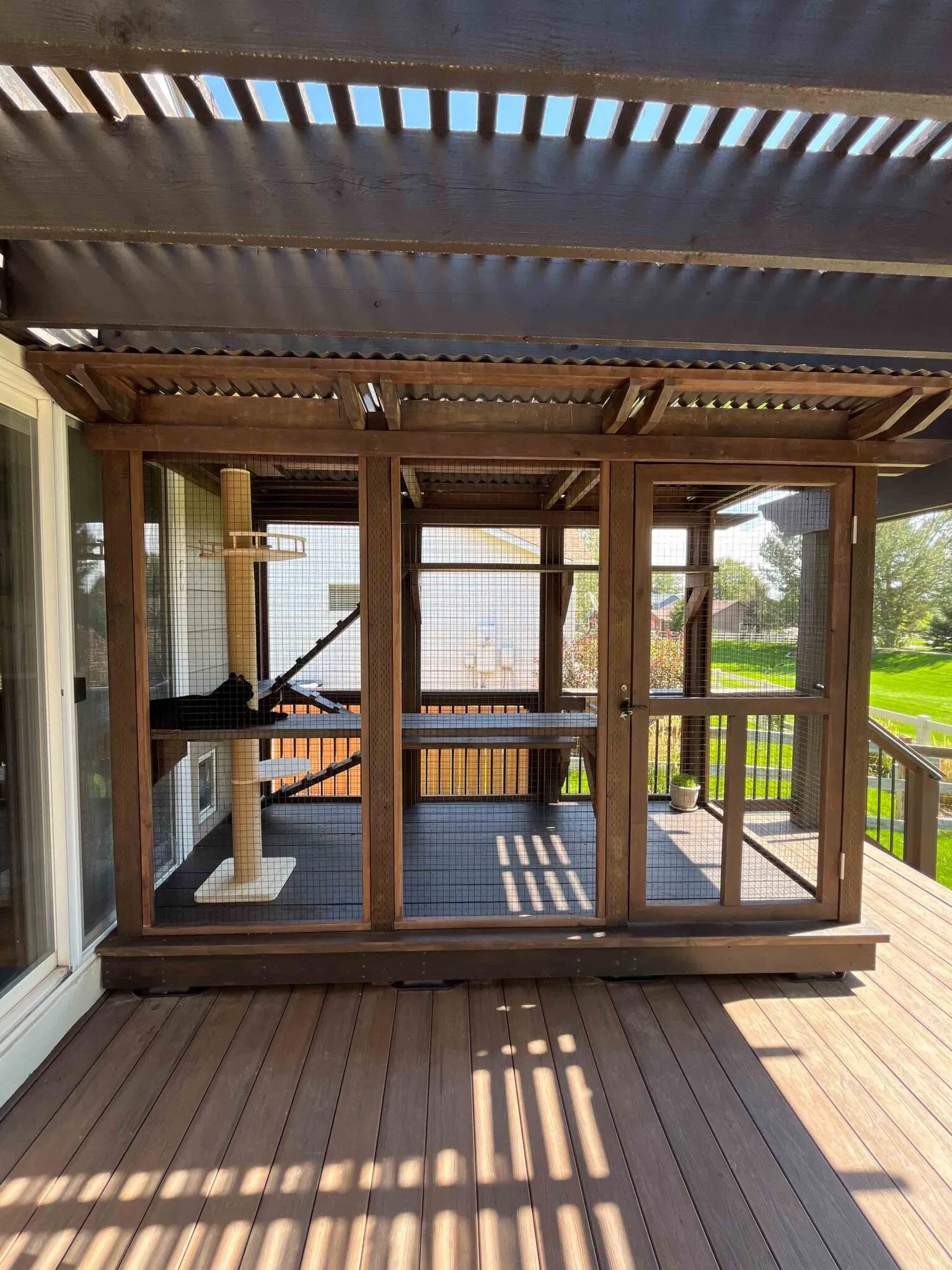 Enclosed Catio on Raised Deck | The Deck Den