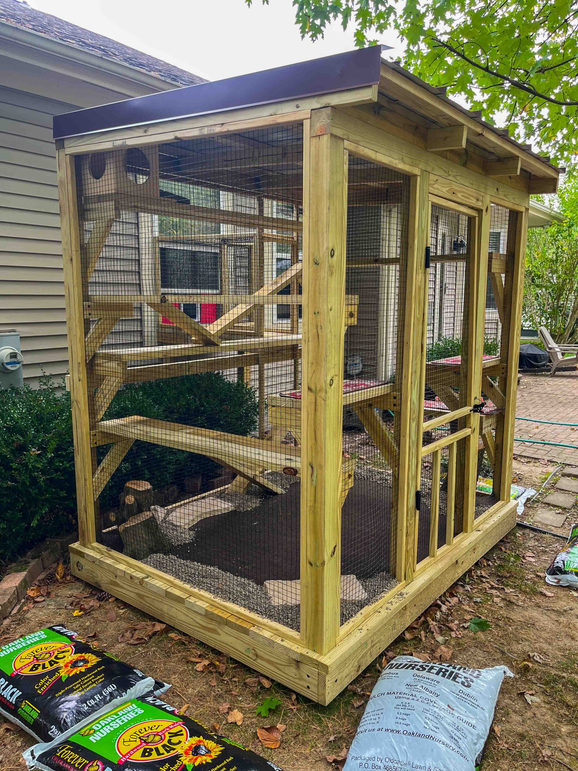 Custom Attached Outdoor Catio with Window Tunnel | The Oakview Escape